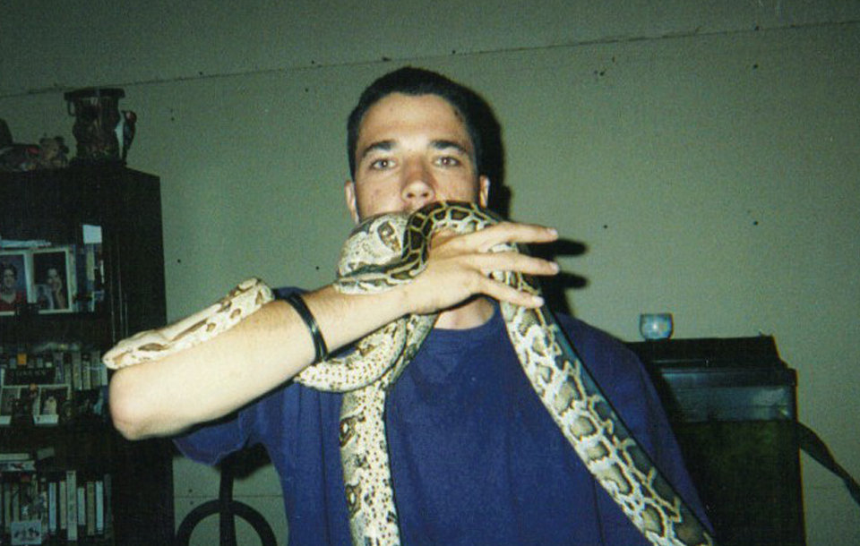 Dad defends decision to let his 13-foot pet python wrap itself around ...